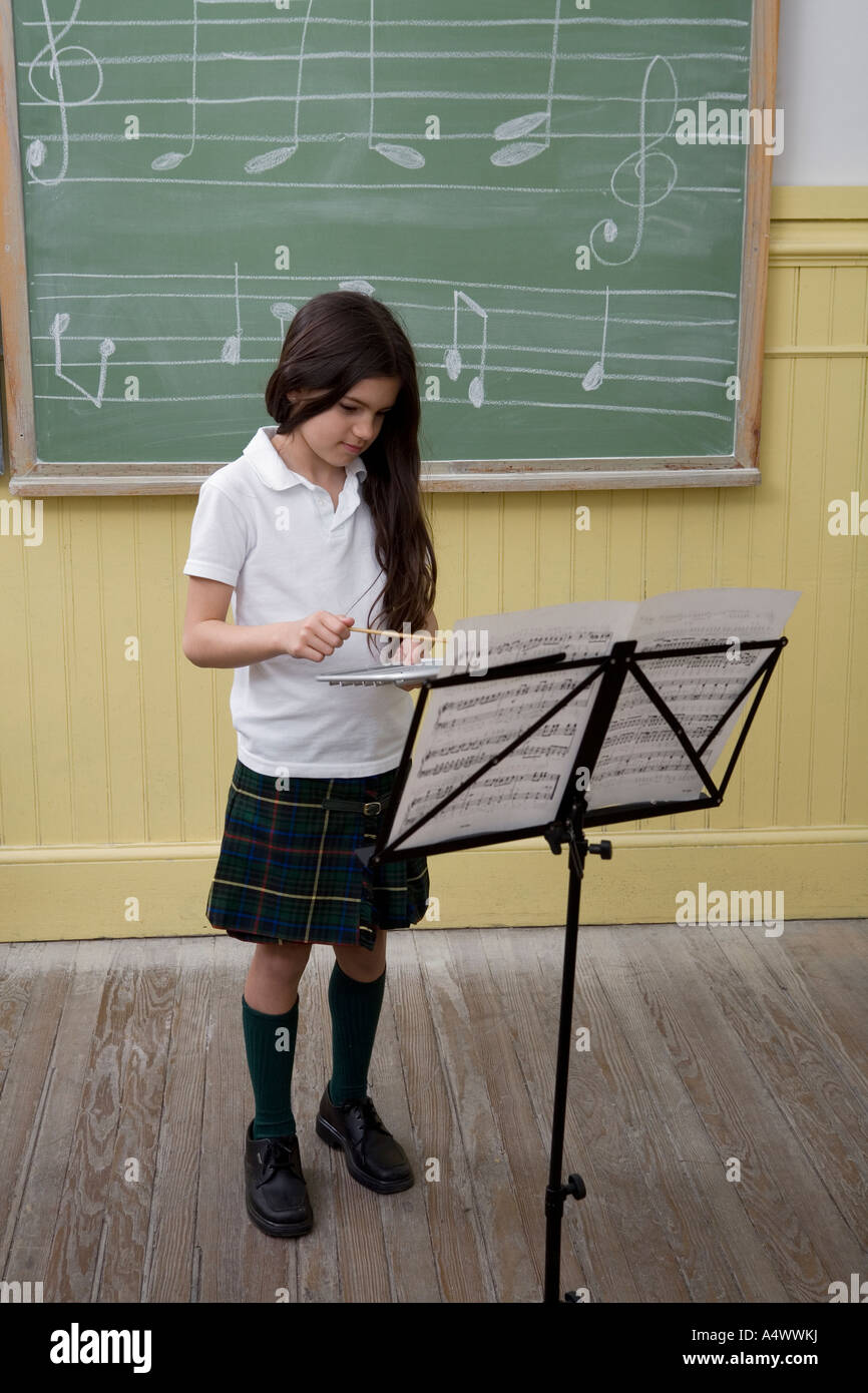 Young student learning to play the tubular bells Stock Photo - Alamy