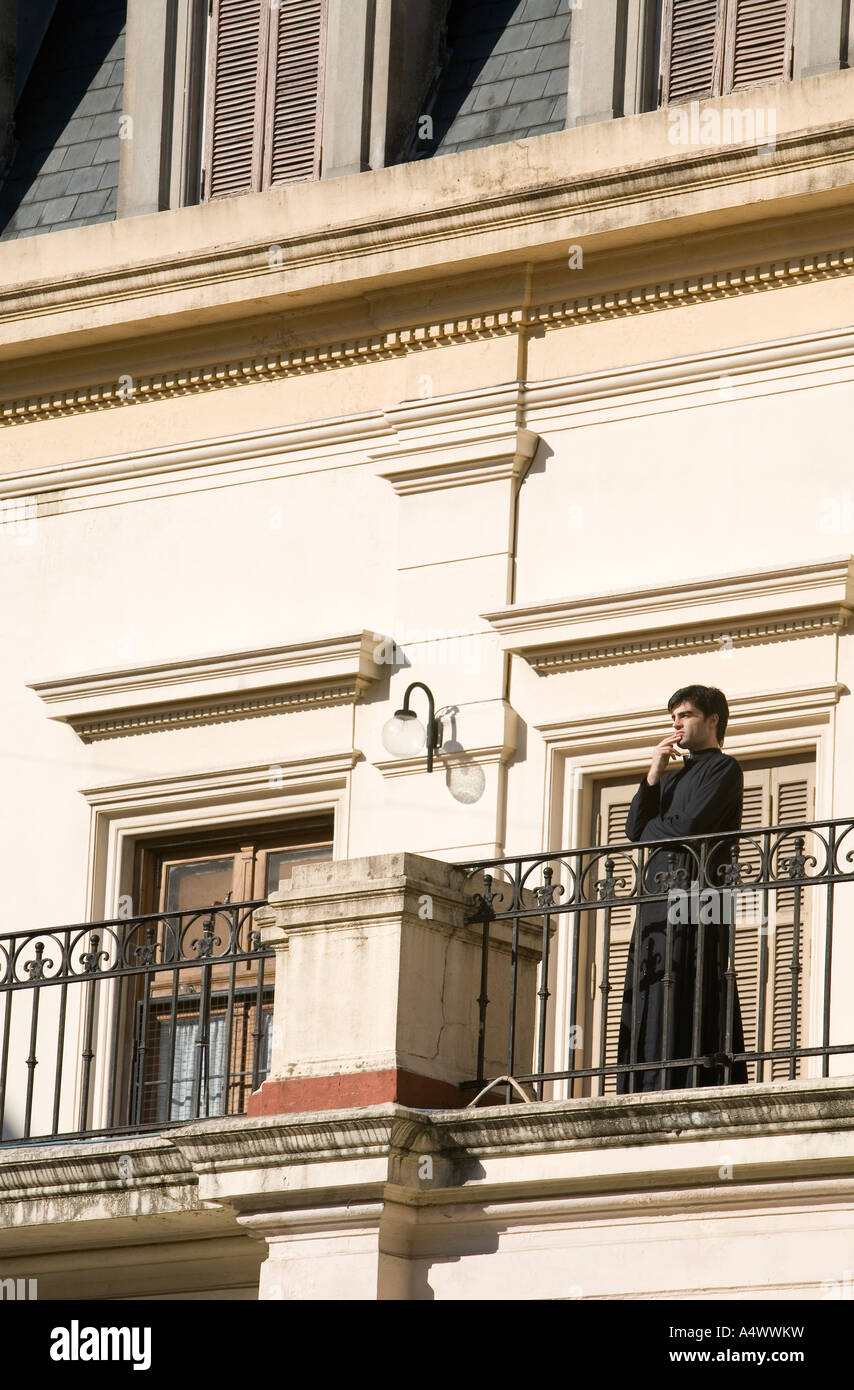 Man overlooking scenery from balcony of ornate building Stock Photo - Alamy