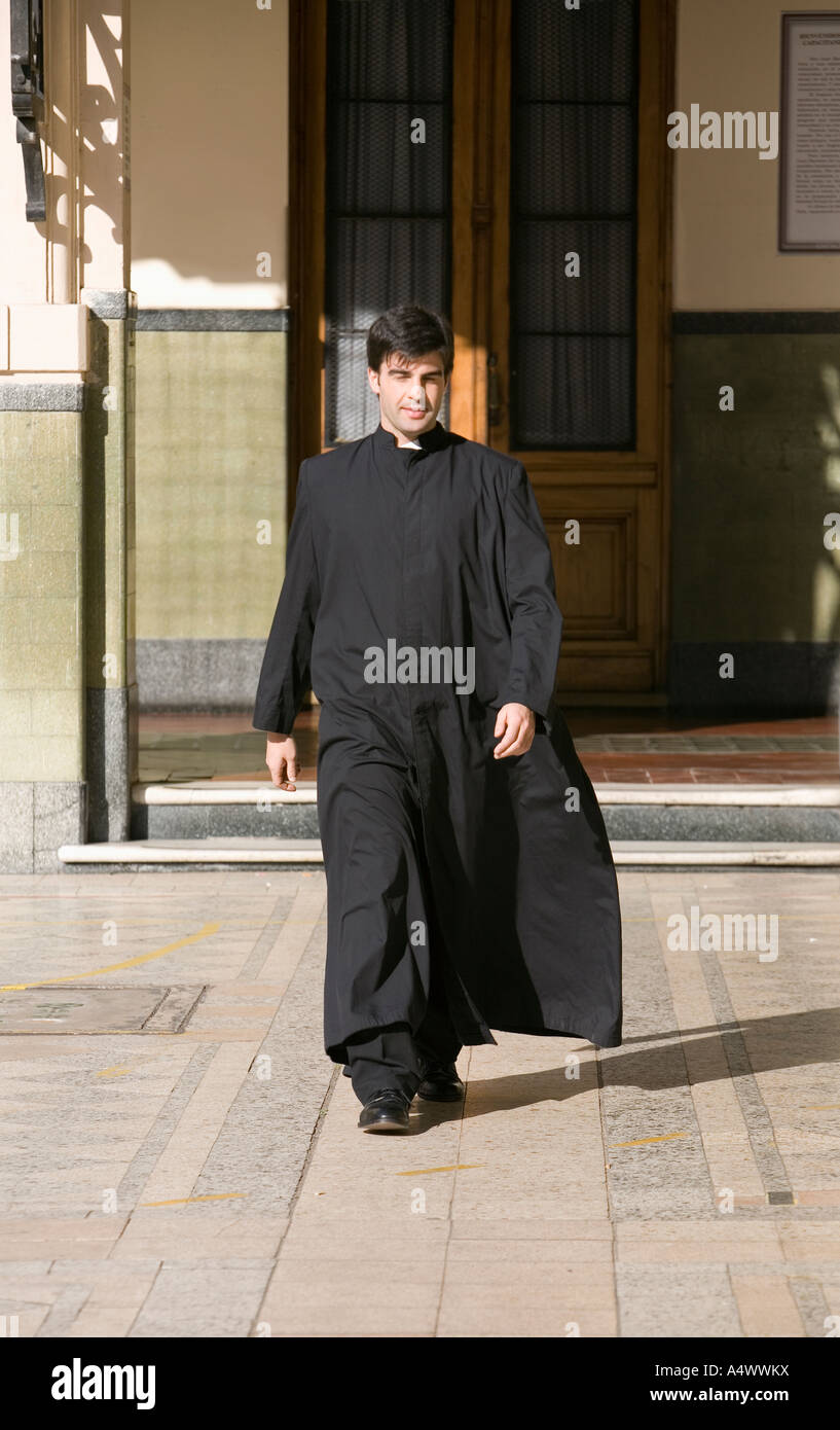 Priest walking hi-res stock photography and images - Alamy