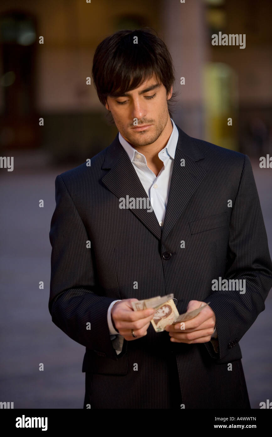 Man counting his money Stock Photo - Alamy