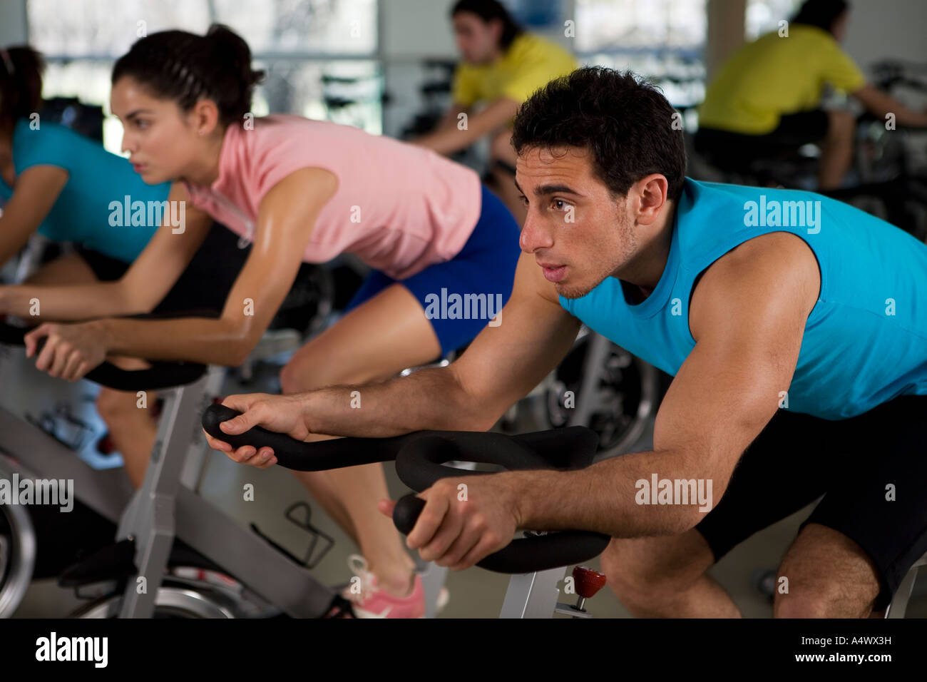 People cycling in a gym Stock Photo - Alamy