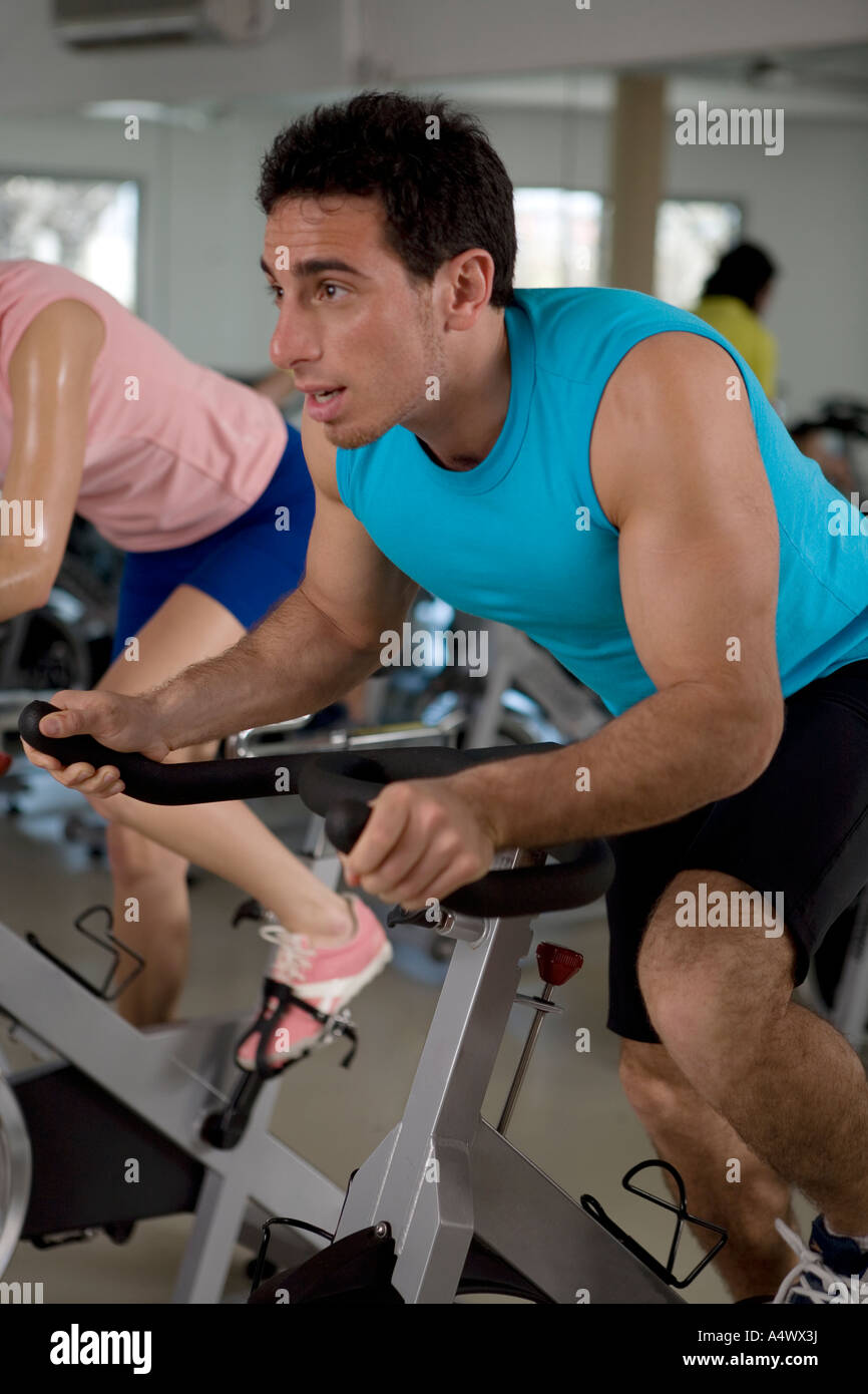 Man cycling in a gym Stock Photo - Alamy