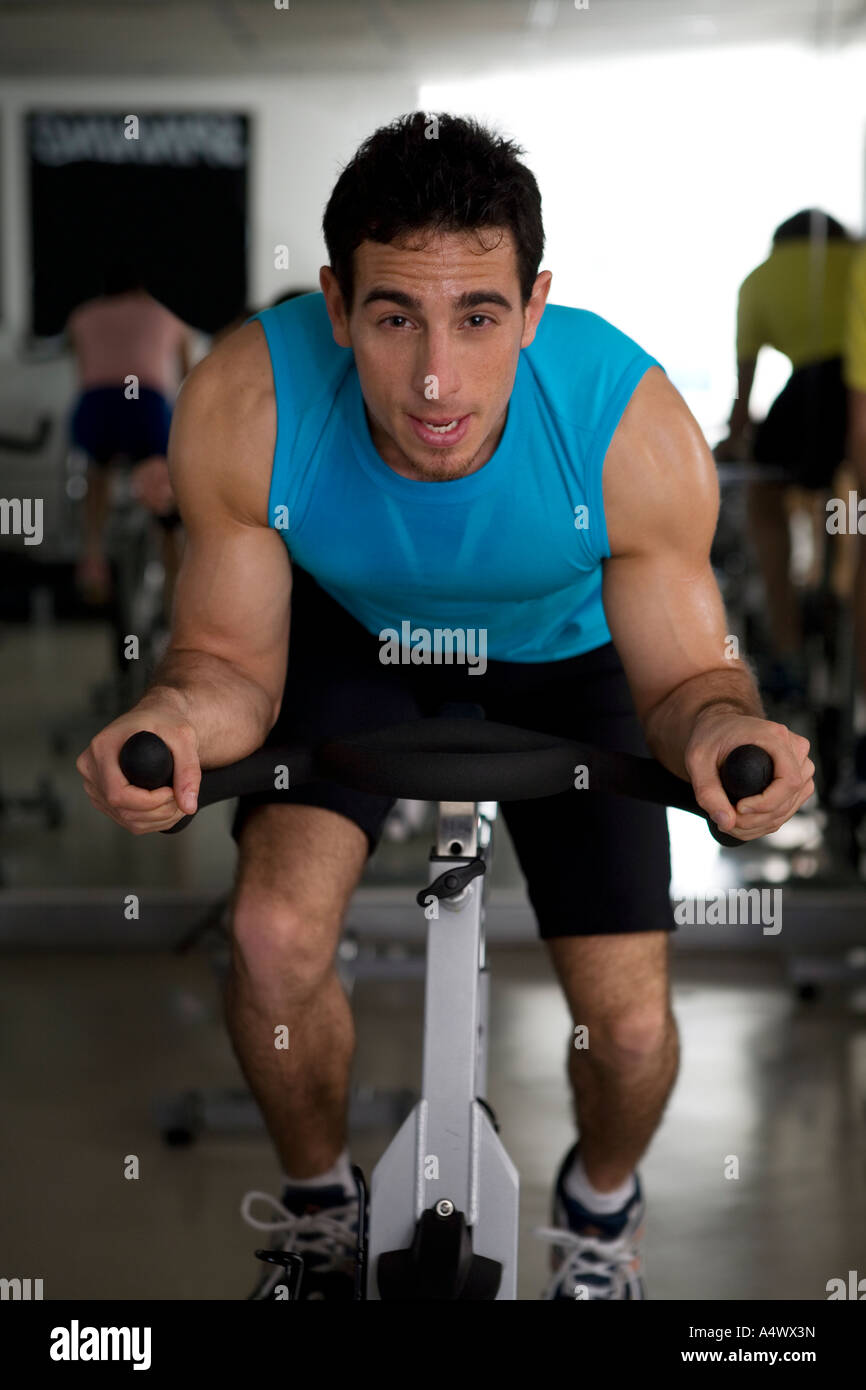 Man cycling in a gym Stock Photo - Alamy