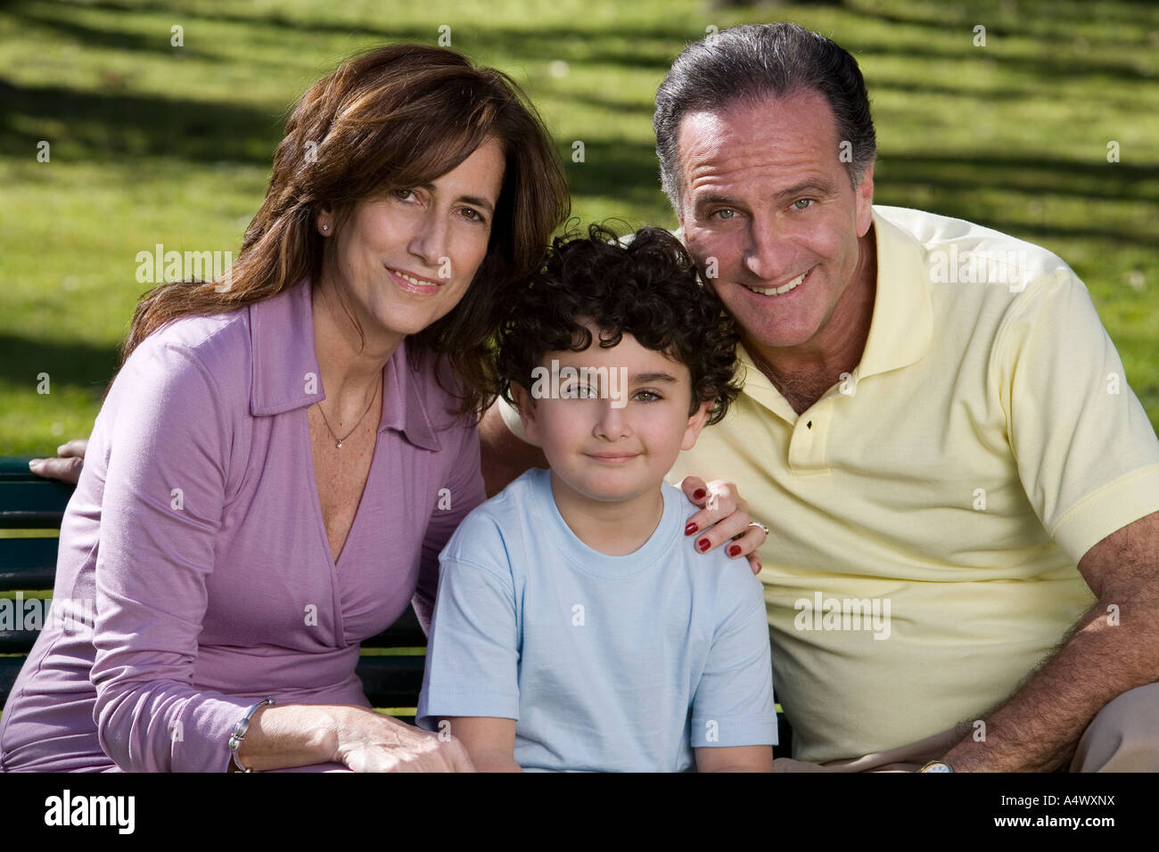 Family smiling together outdoors Stock Photo - Alamy