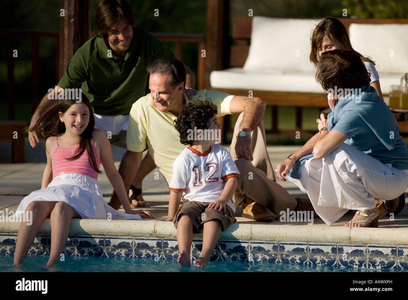Family at the pool hi-res stock photography and images - Alamy