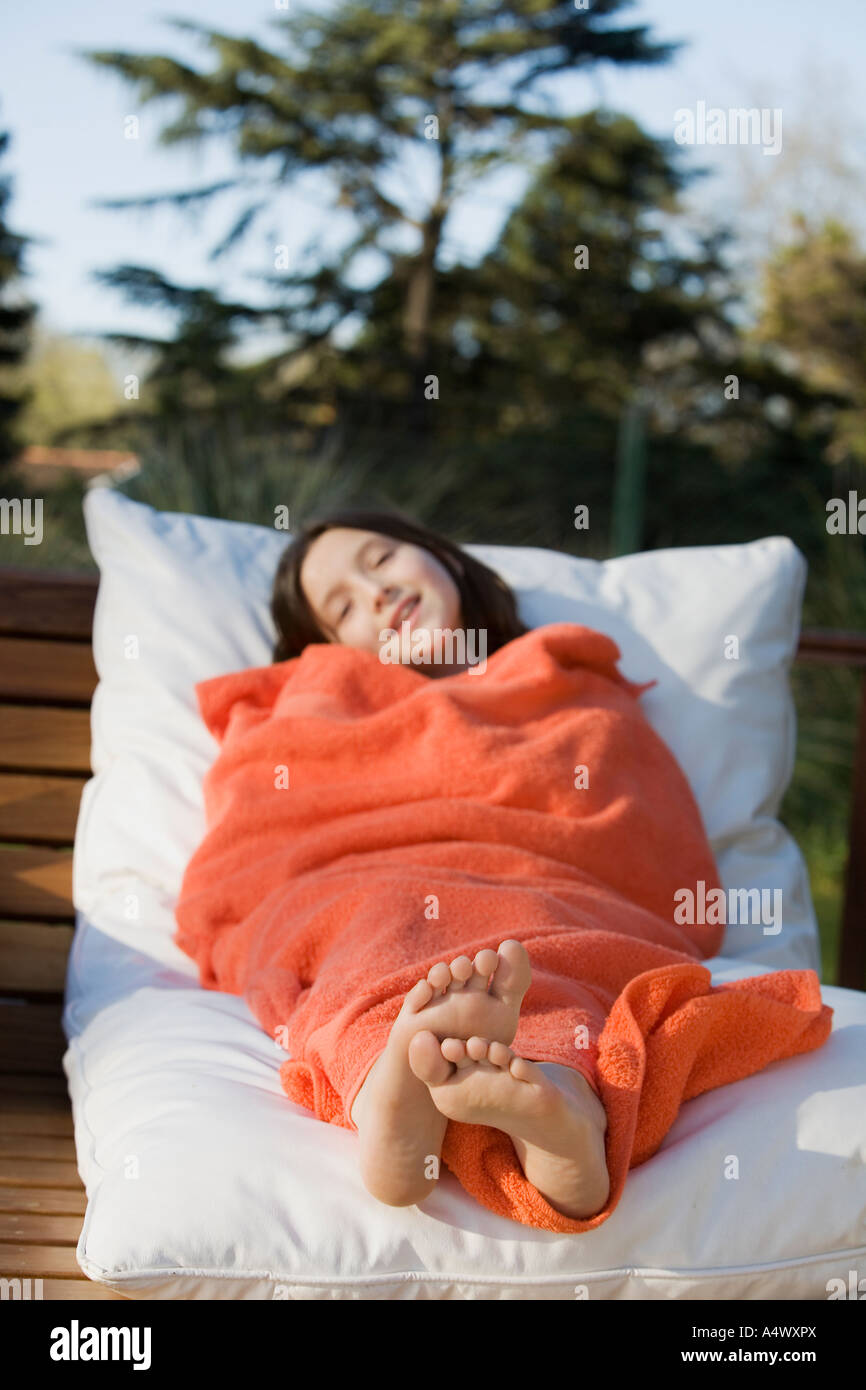 Young girl wrapped in a towel Stock Photo - Alamy