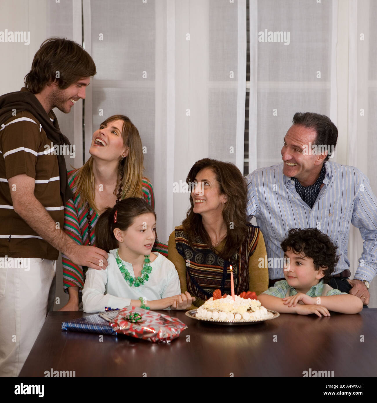 Family laughing at birthday party Stock Photo - Alamy