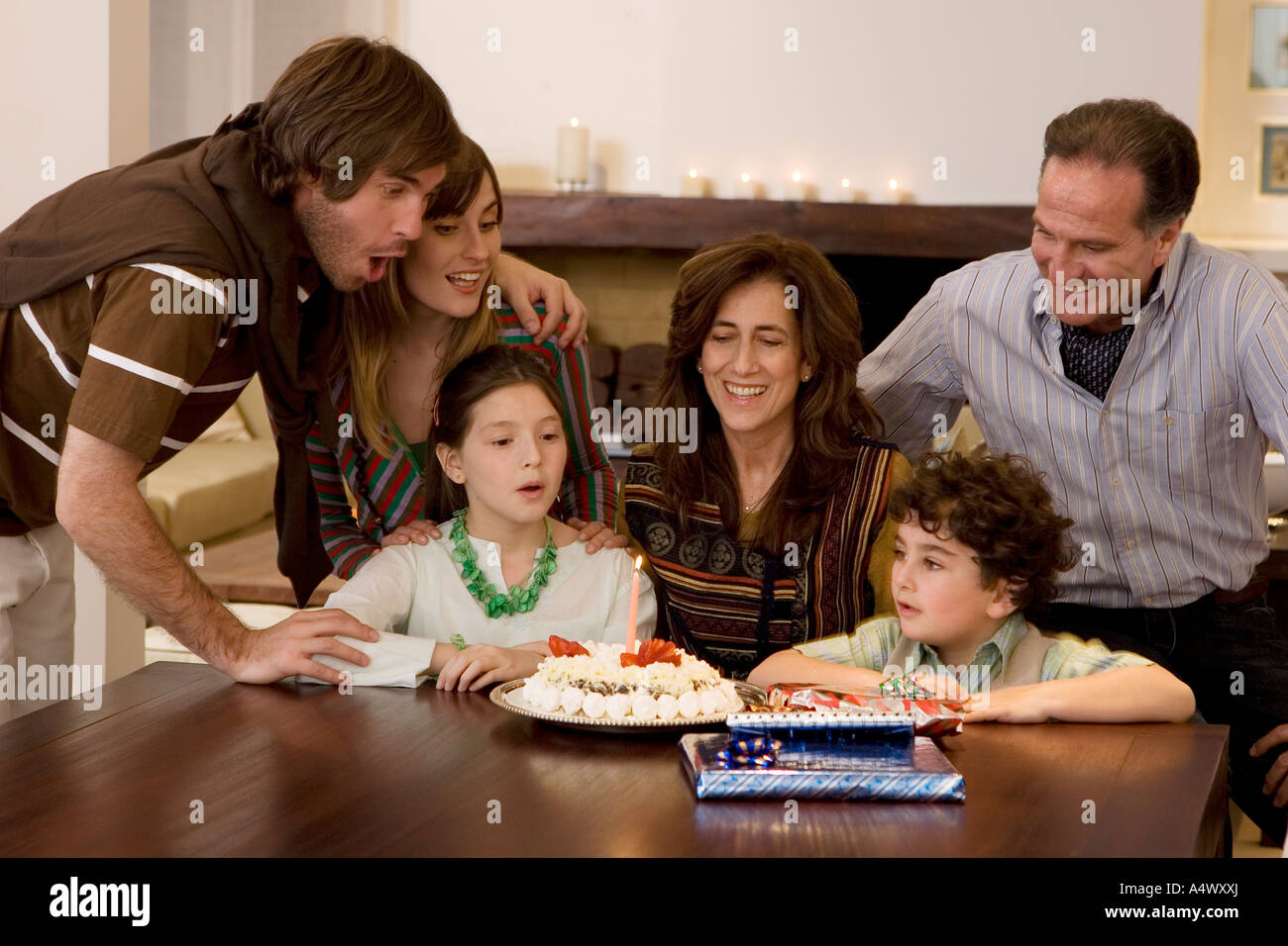 Family laughing at birthday party Stock Photo - Alamy