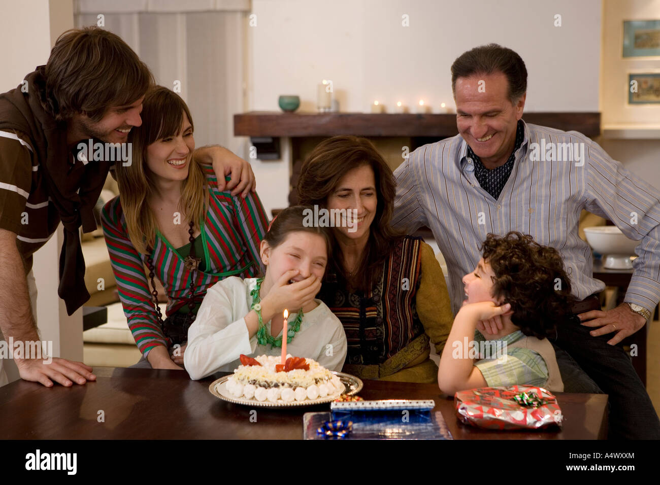 Family laughing at birthday party Stock Photo - Alamy