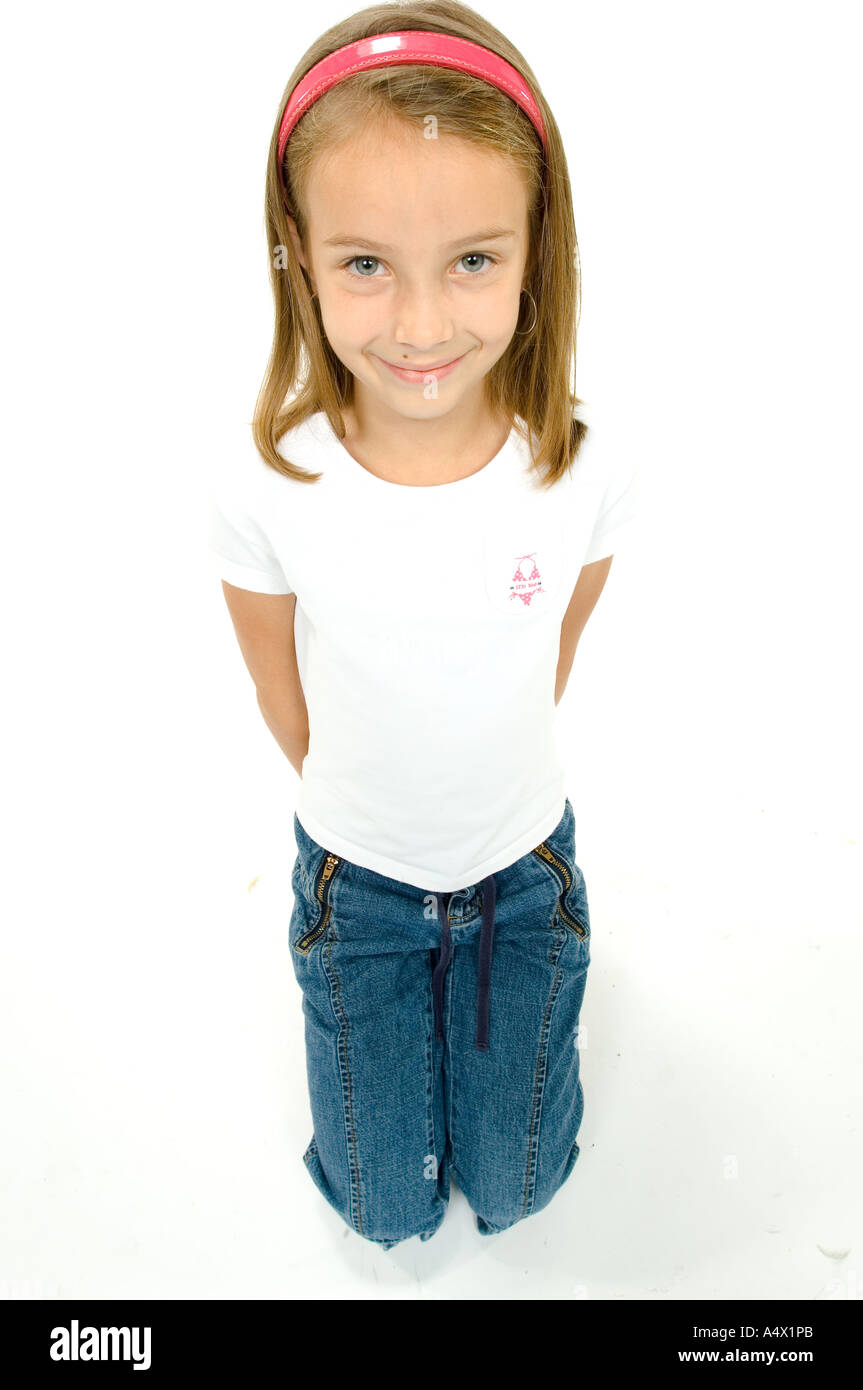 YOUNG GIRL KNEELING Stock Photo - Alamy