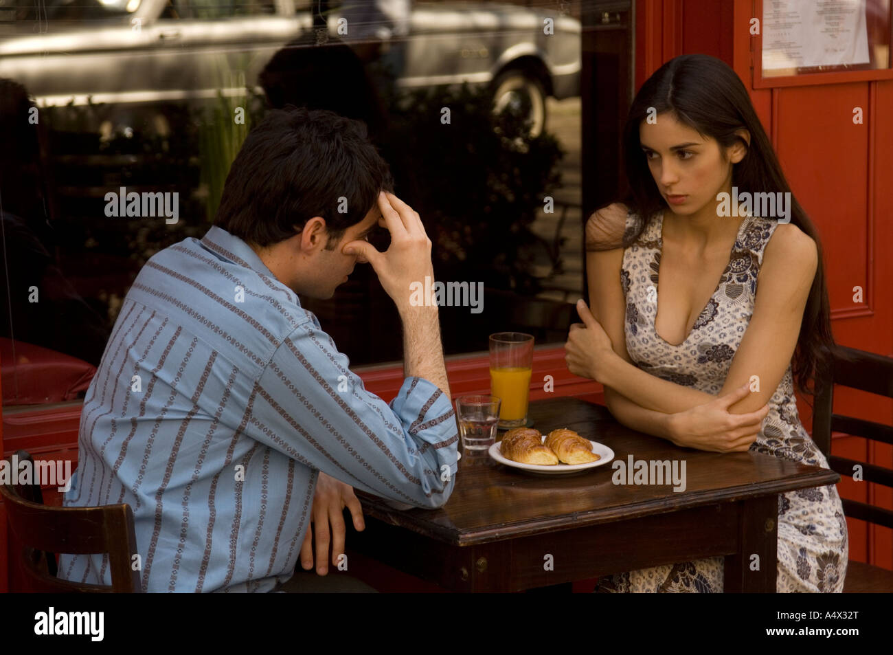Couple arguing over breakfast at an outdoor cafe Stock Photo - Alamy