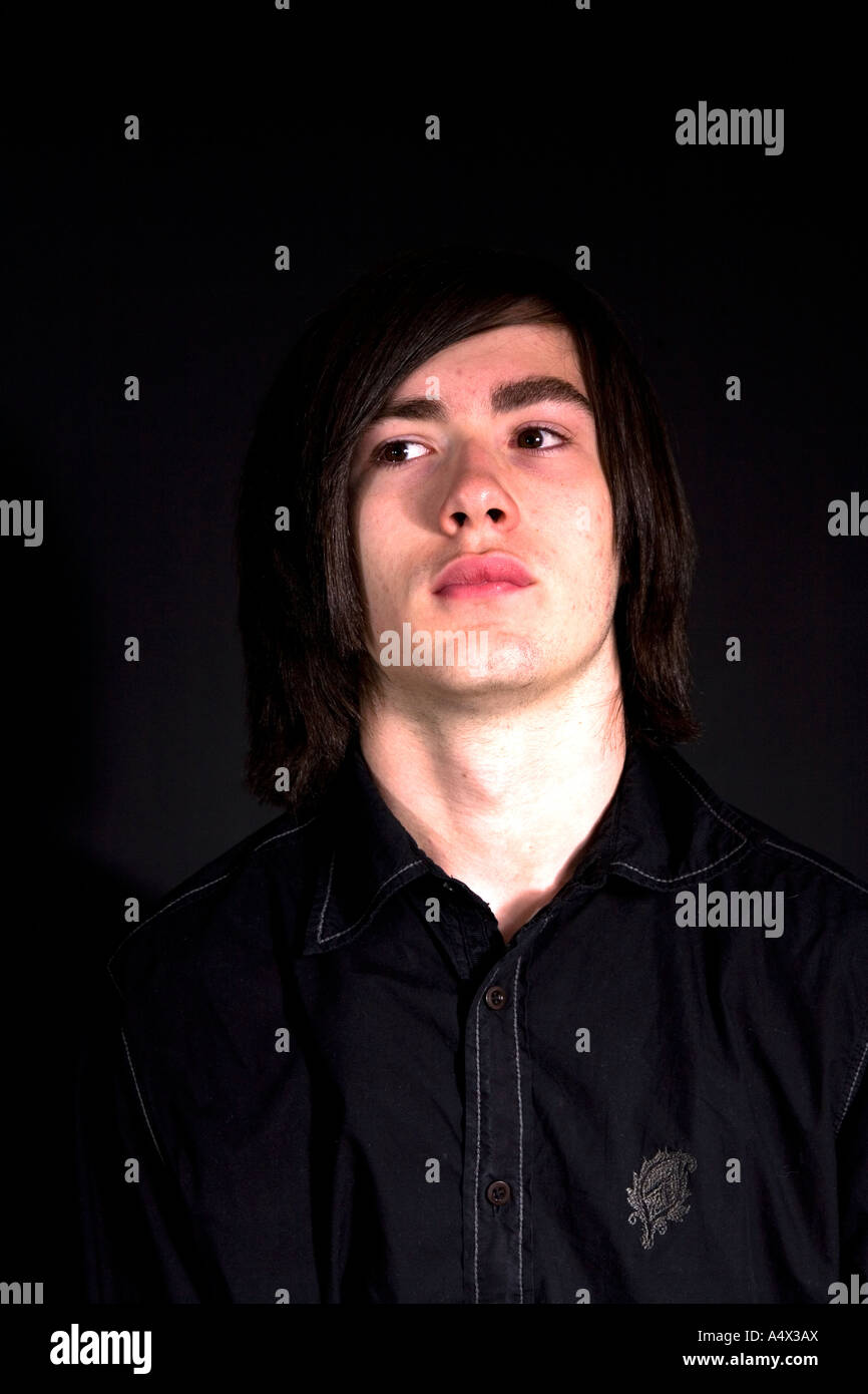 Young man with long hair sideways glance with tears in his eyes Stock ...