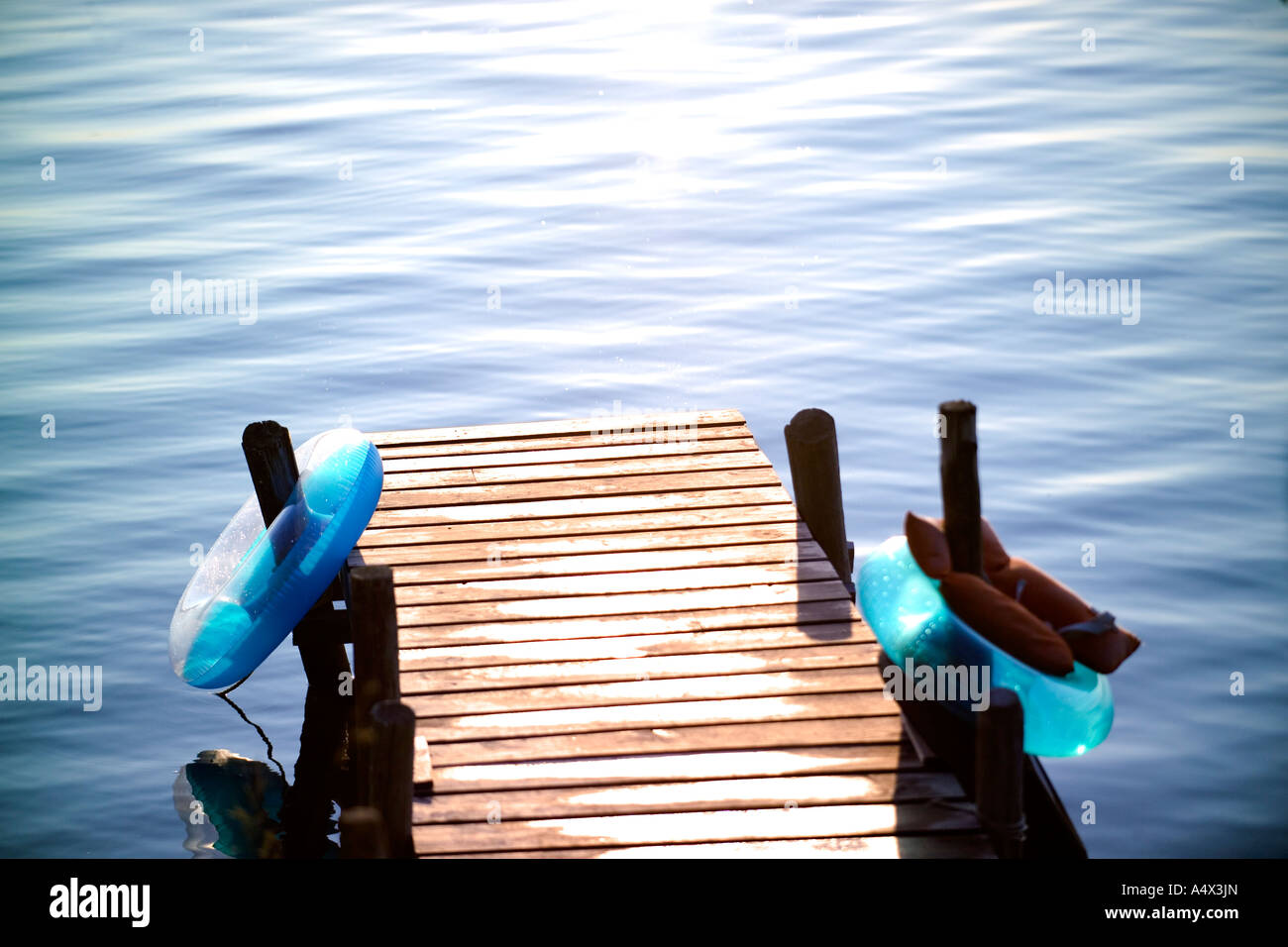 Dock and inner tube on a Lake Stock Photo - Alamy