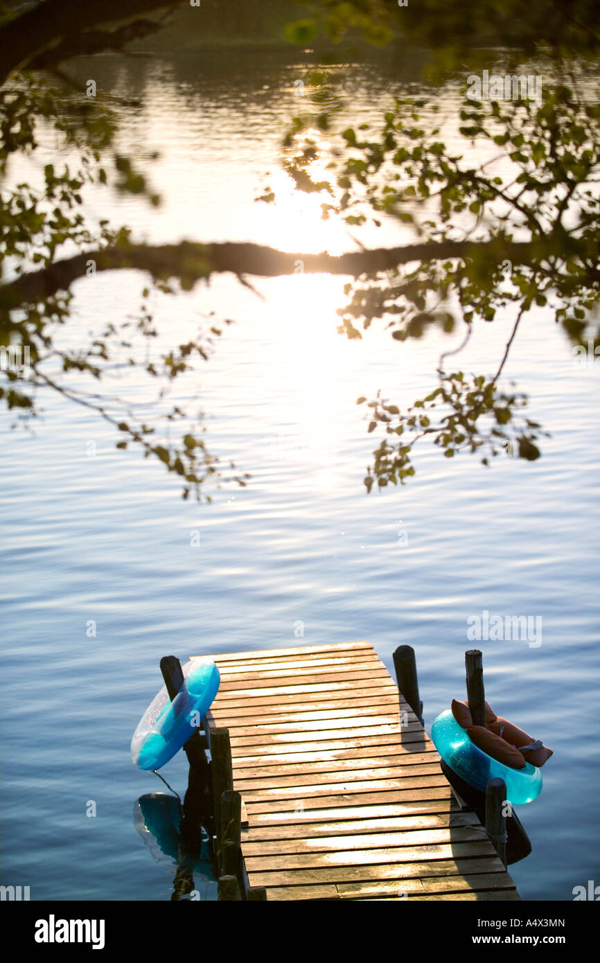 Dock and inner tube on a Lake Stock Photo - Alamy