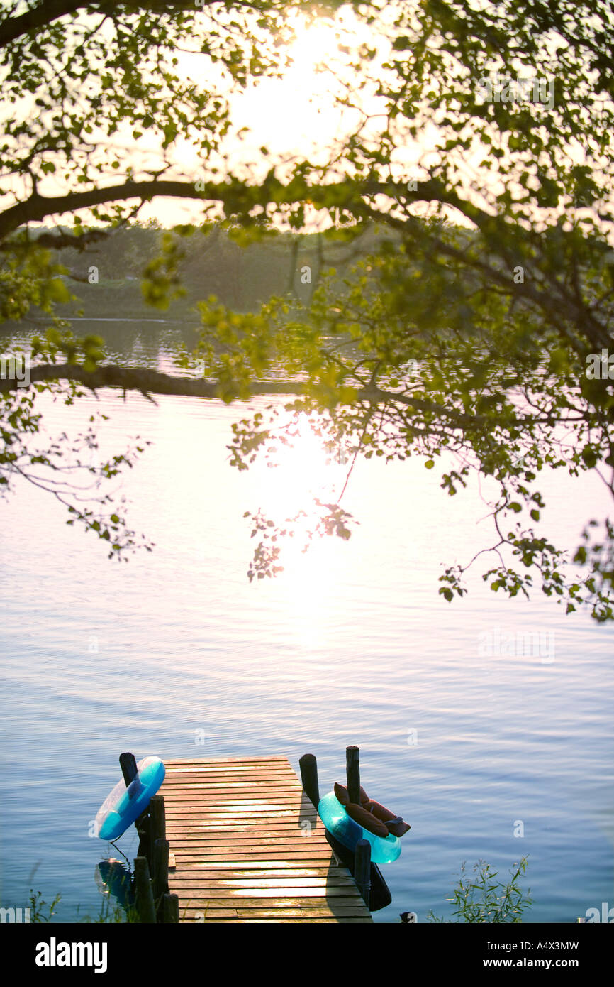 Dock and inner tube on a Lake Stock Photo - Alamy