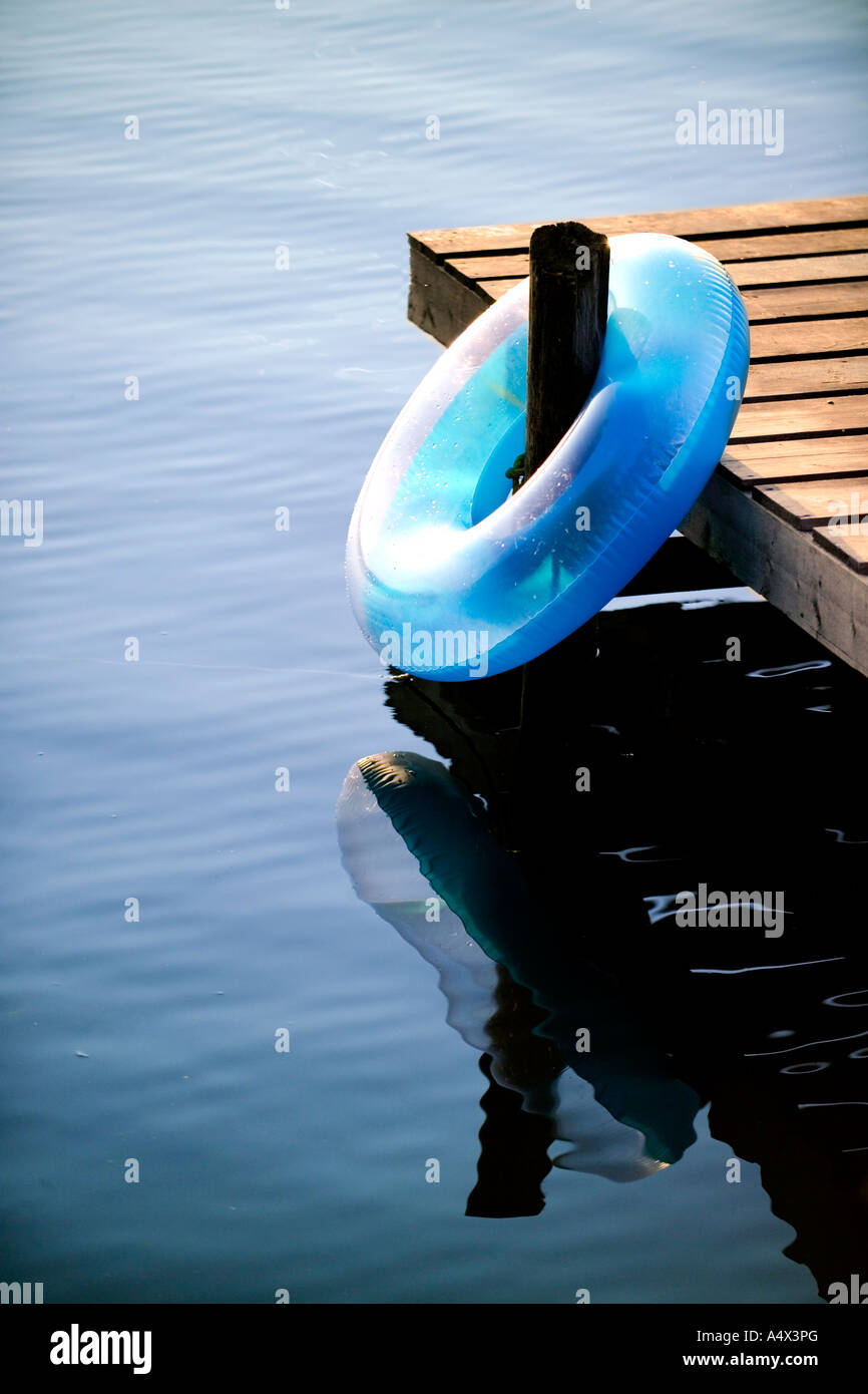 Dock and inner tube on a Lake Stock Photo - Alamy
