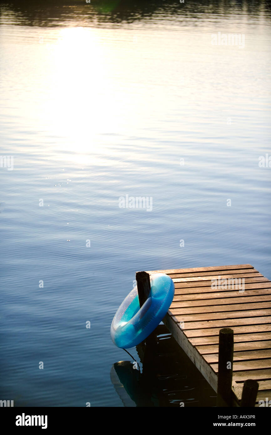 Dock and inner tube on a Lake Stock Photo - Alamy