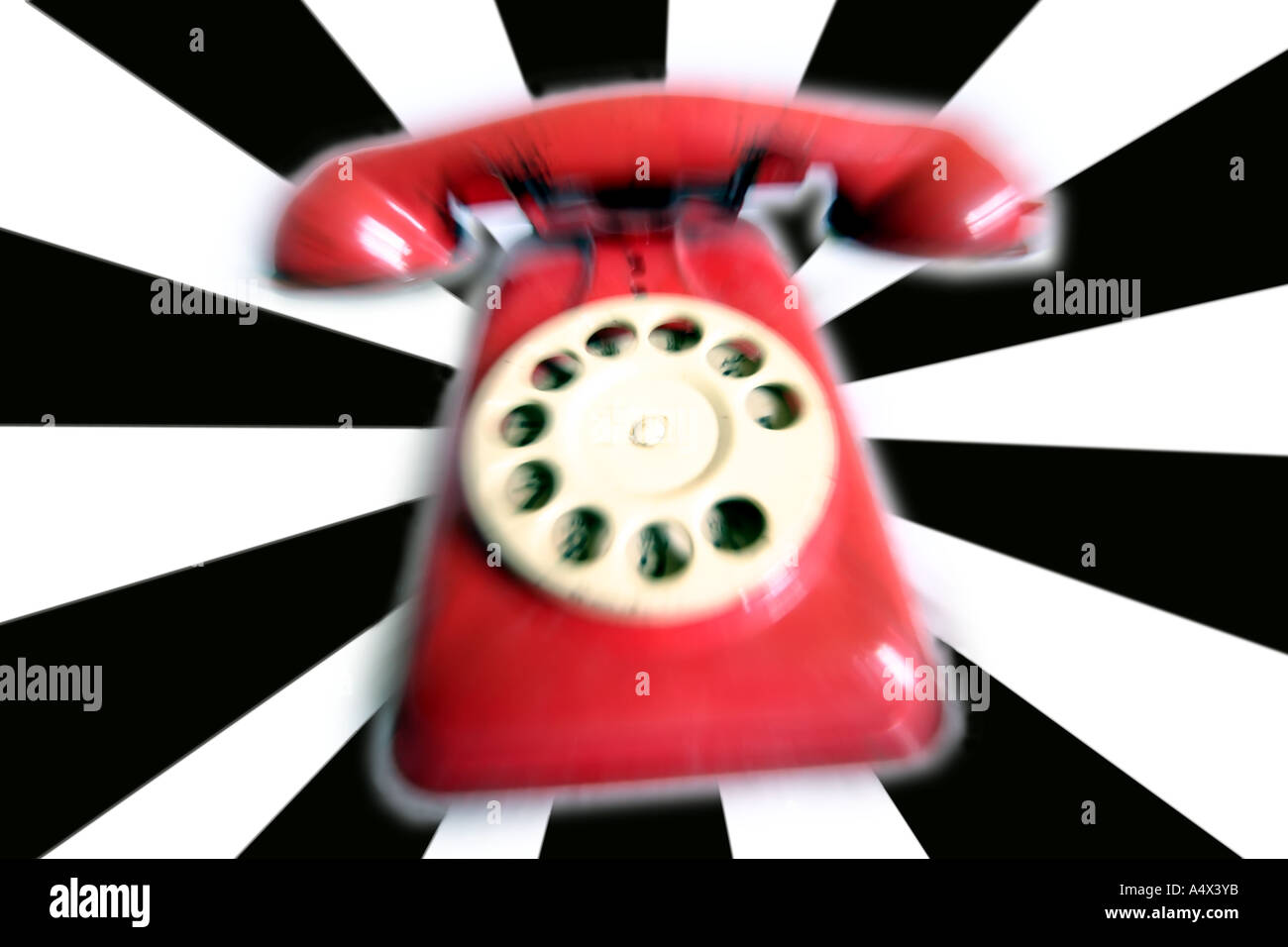 red toy telephone against black and white sunburst Stock Photo - Alamy