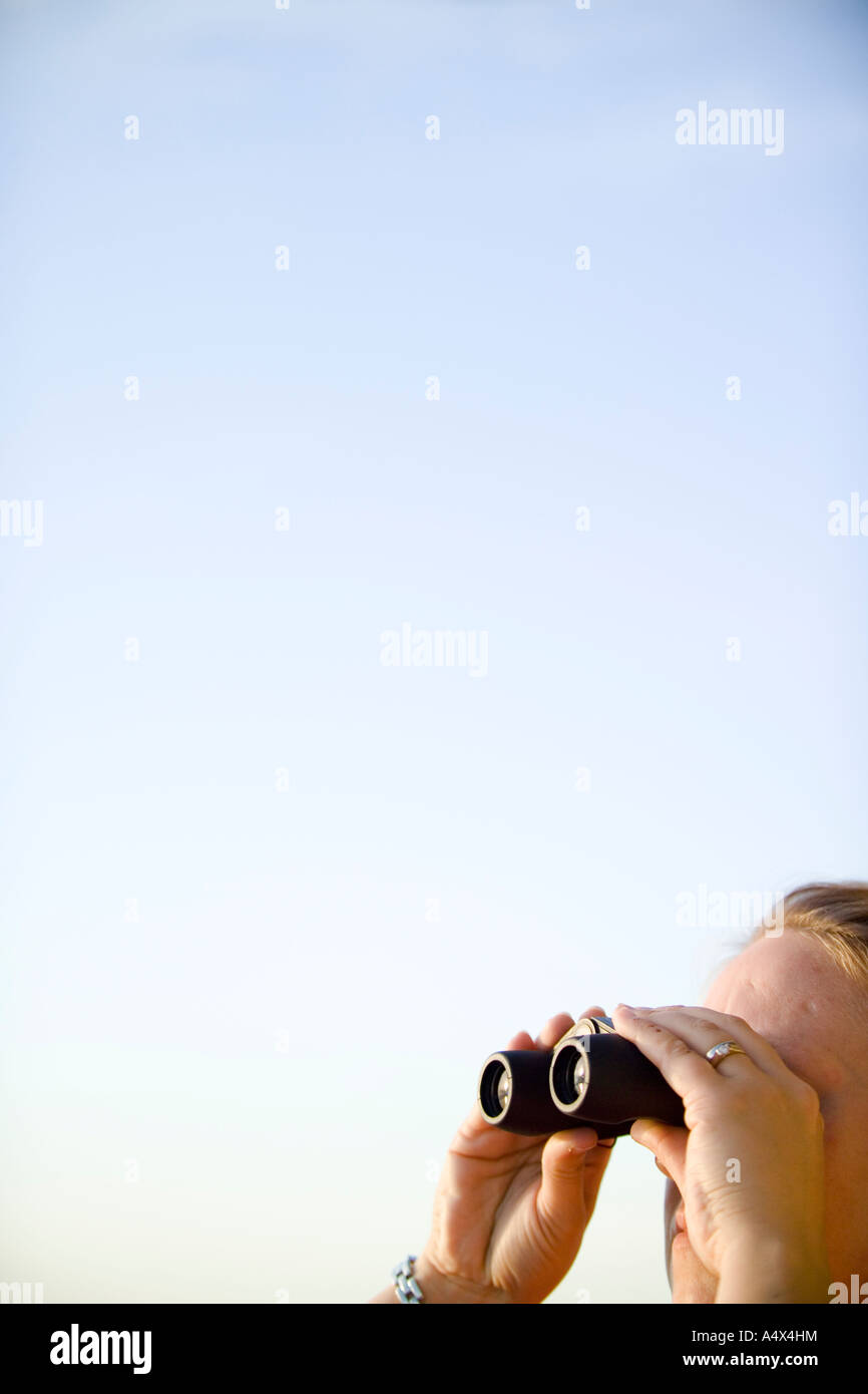 Birder looking through binoculars Stock Photo - Alamy