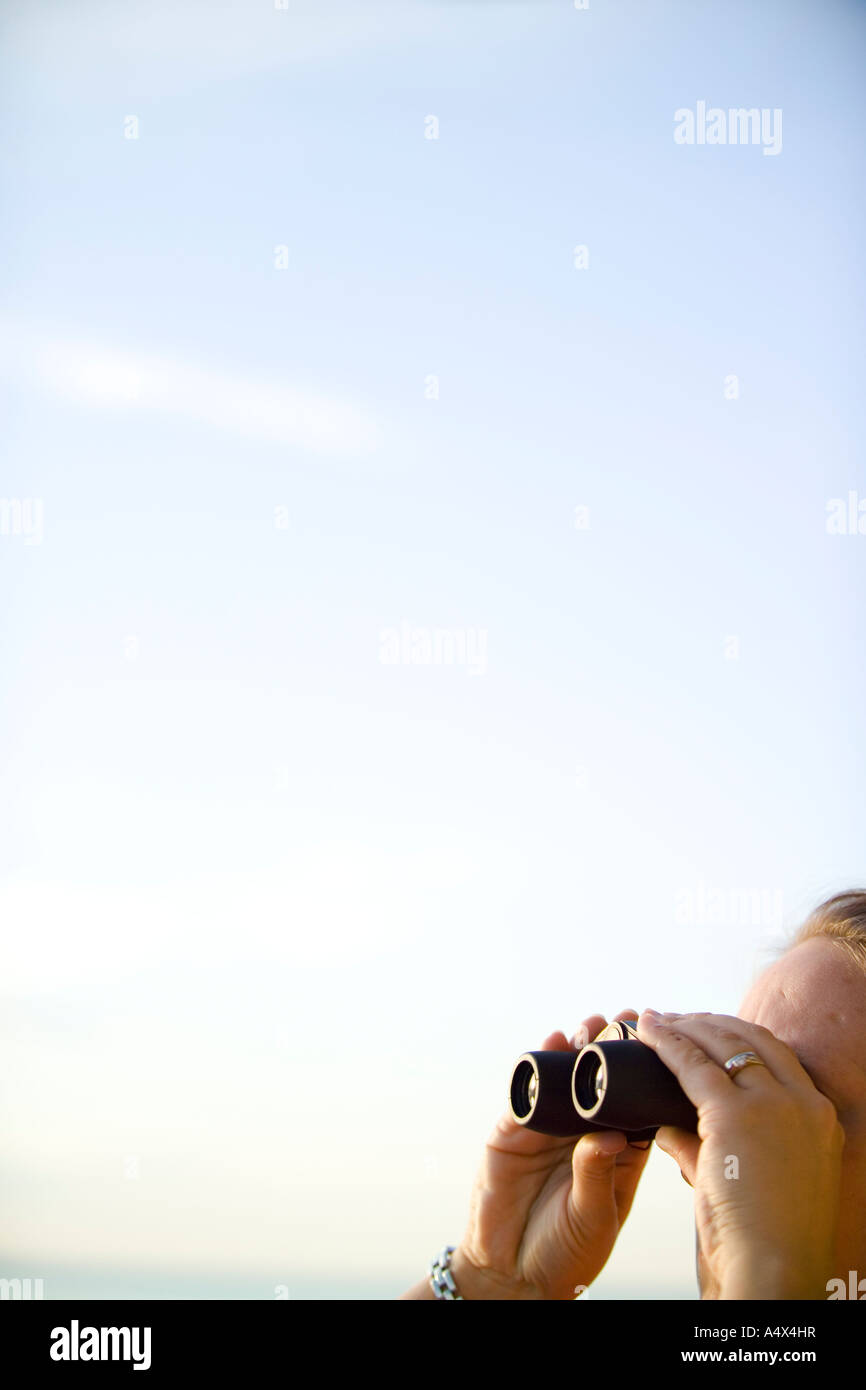 Birder looking through binoculars Stock Photo - Alamy