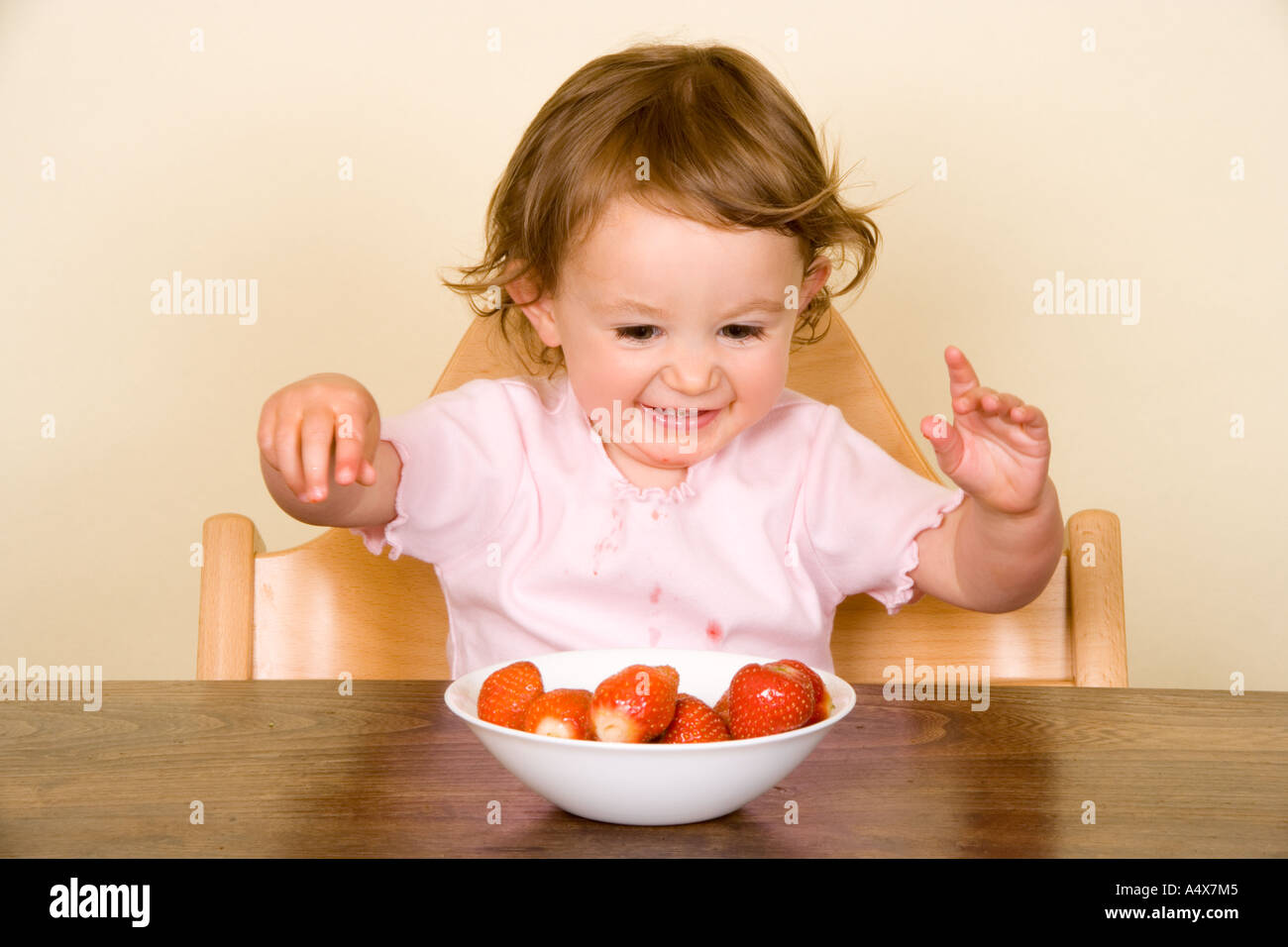 Baby eating strawberries hi-res stock photography and images - Alamy