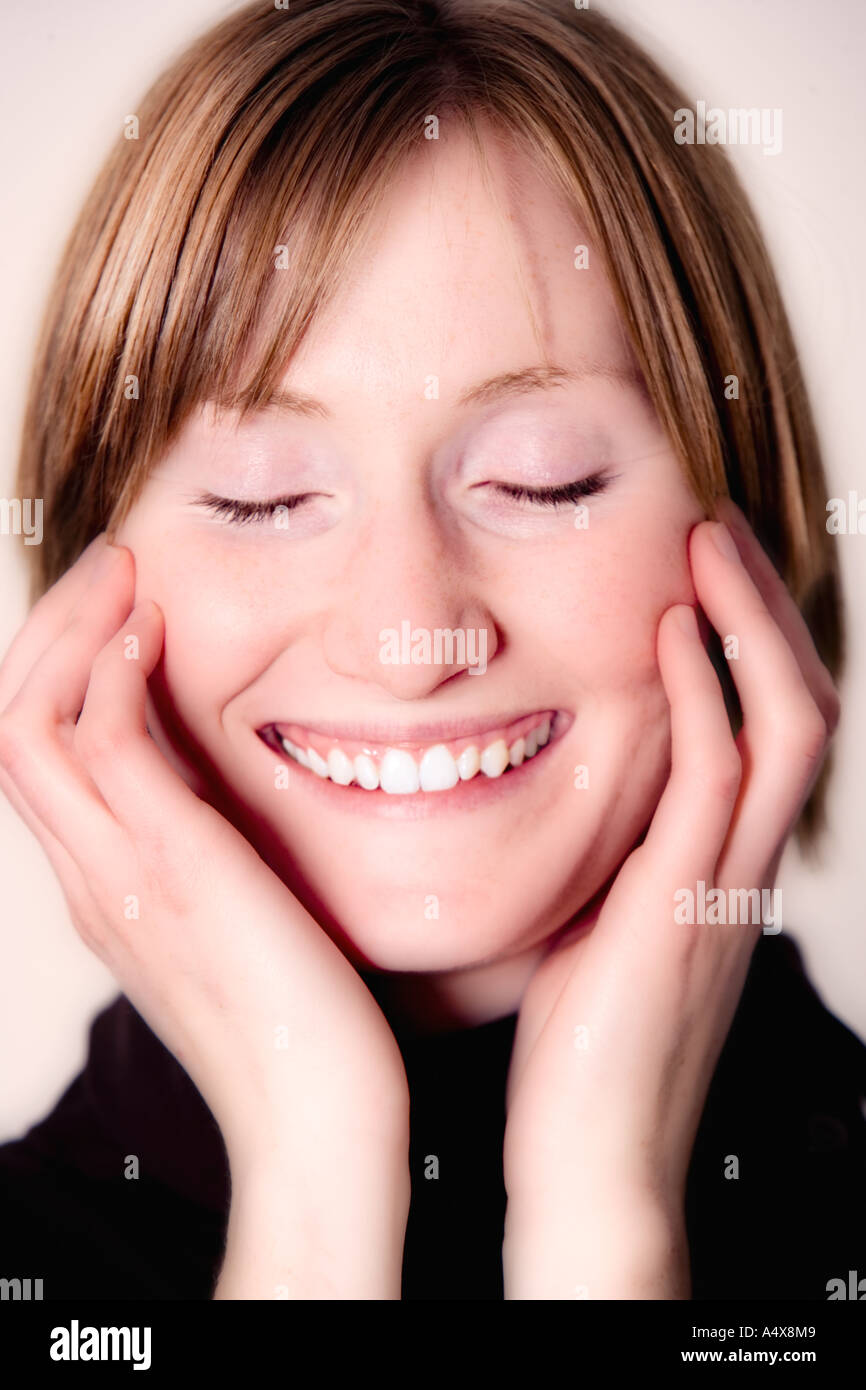 Woman eyes closed touching chin hi-res stock photography and images - Alamy