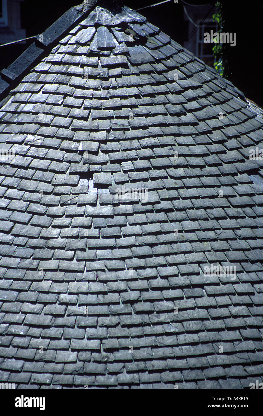 TRADITIONAL SKILLS Conical slated roof in welsh blue slate with damage ...