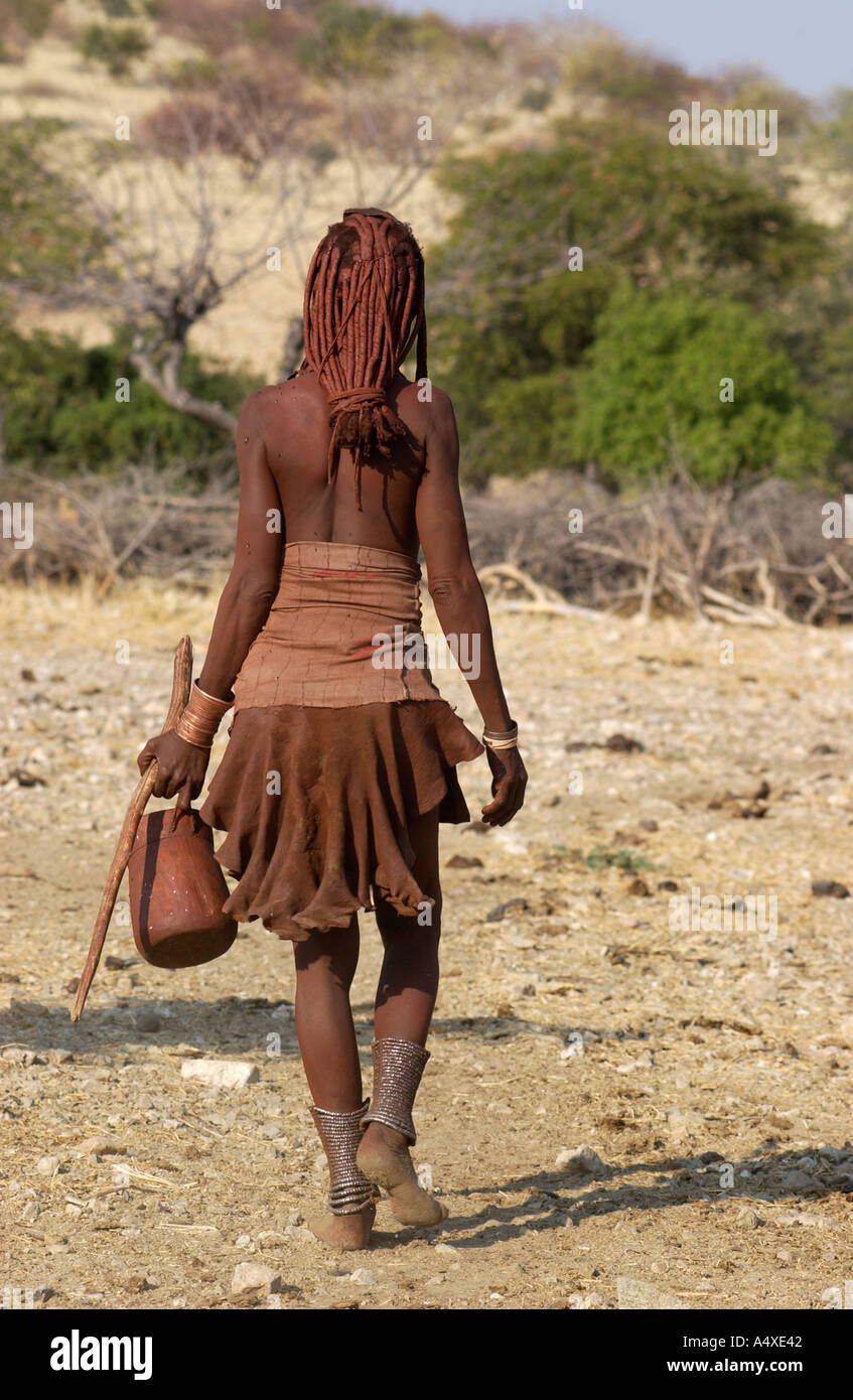 Himba woman walking Stock Photo - Alamy