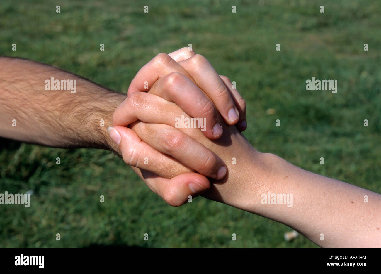 Fingers interlinked hi-res stock photography and images - Alamy