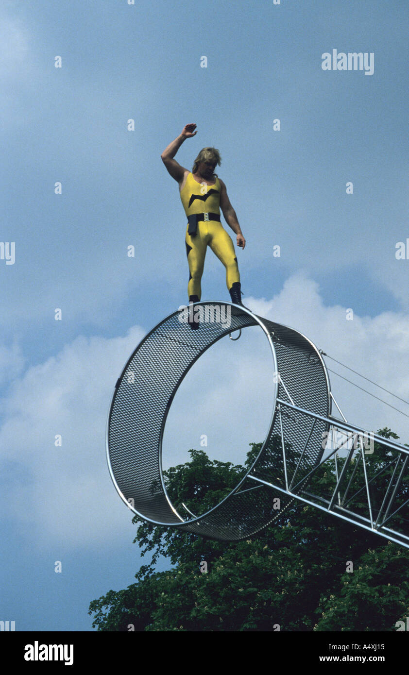 Circus Performer Balancing On Giant Wheel Stock Photo - Alamy