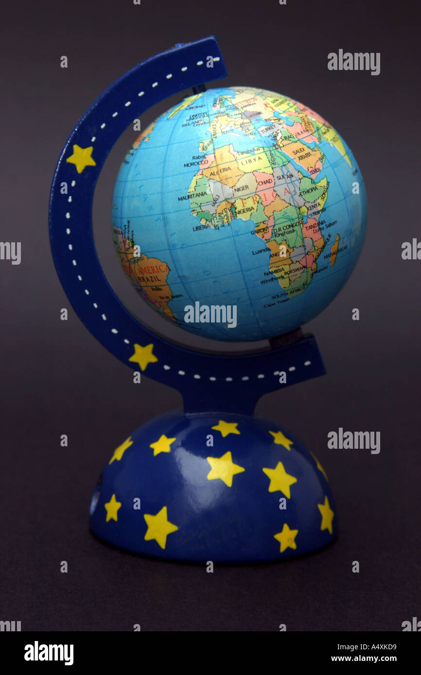 Small globe of the Earth against a dark background Stock Photo - Alamy
