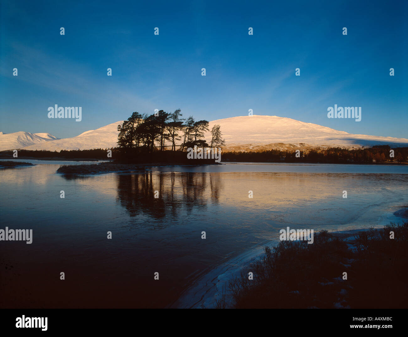 Frozen Loch Tulla Rannoch Moor with the hills of the Blackmount in ...