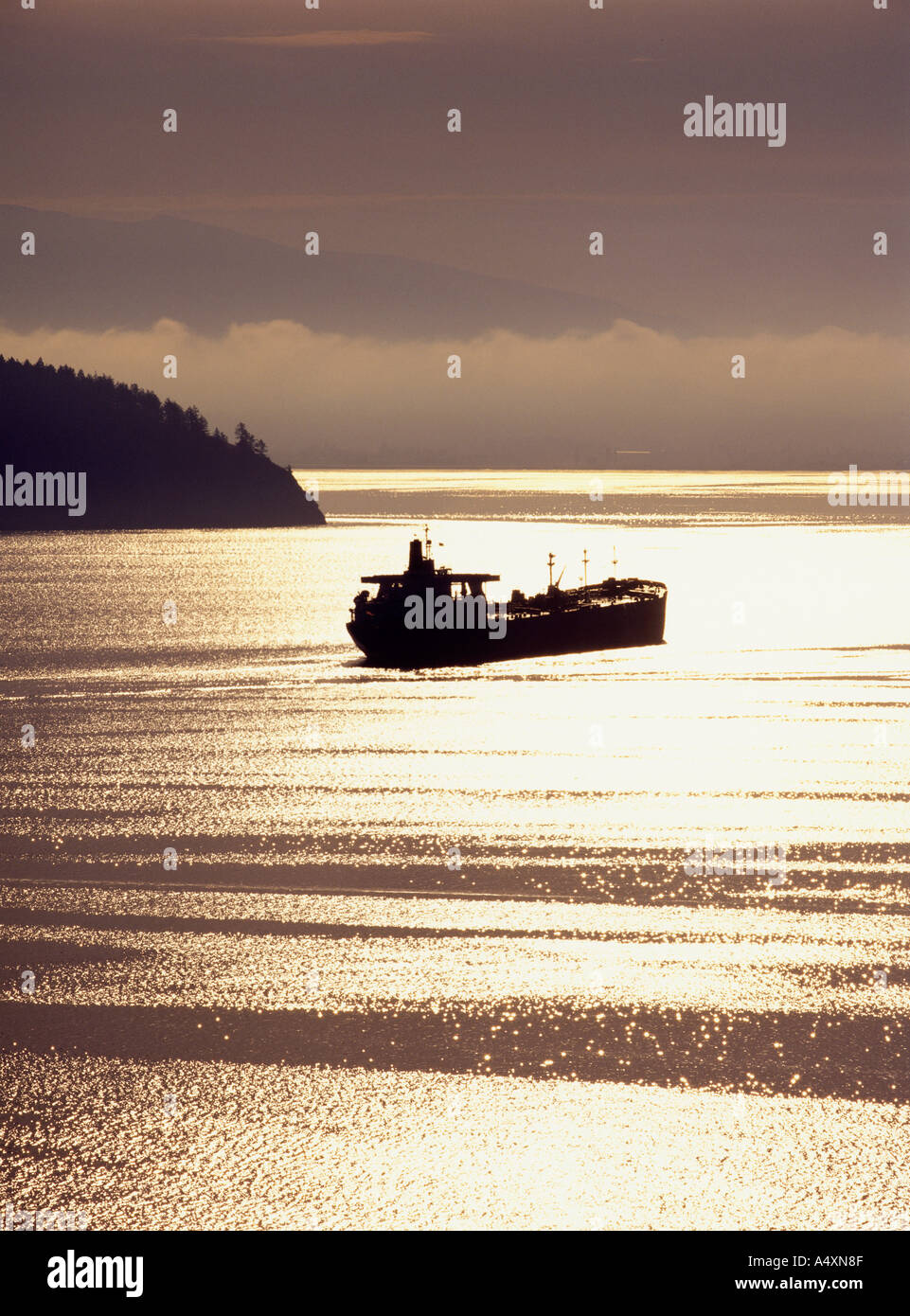 Cargo ship plies the waters around the San Juan Islands of Puget Sound ...