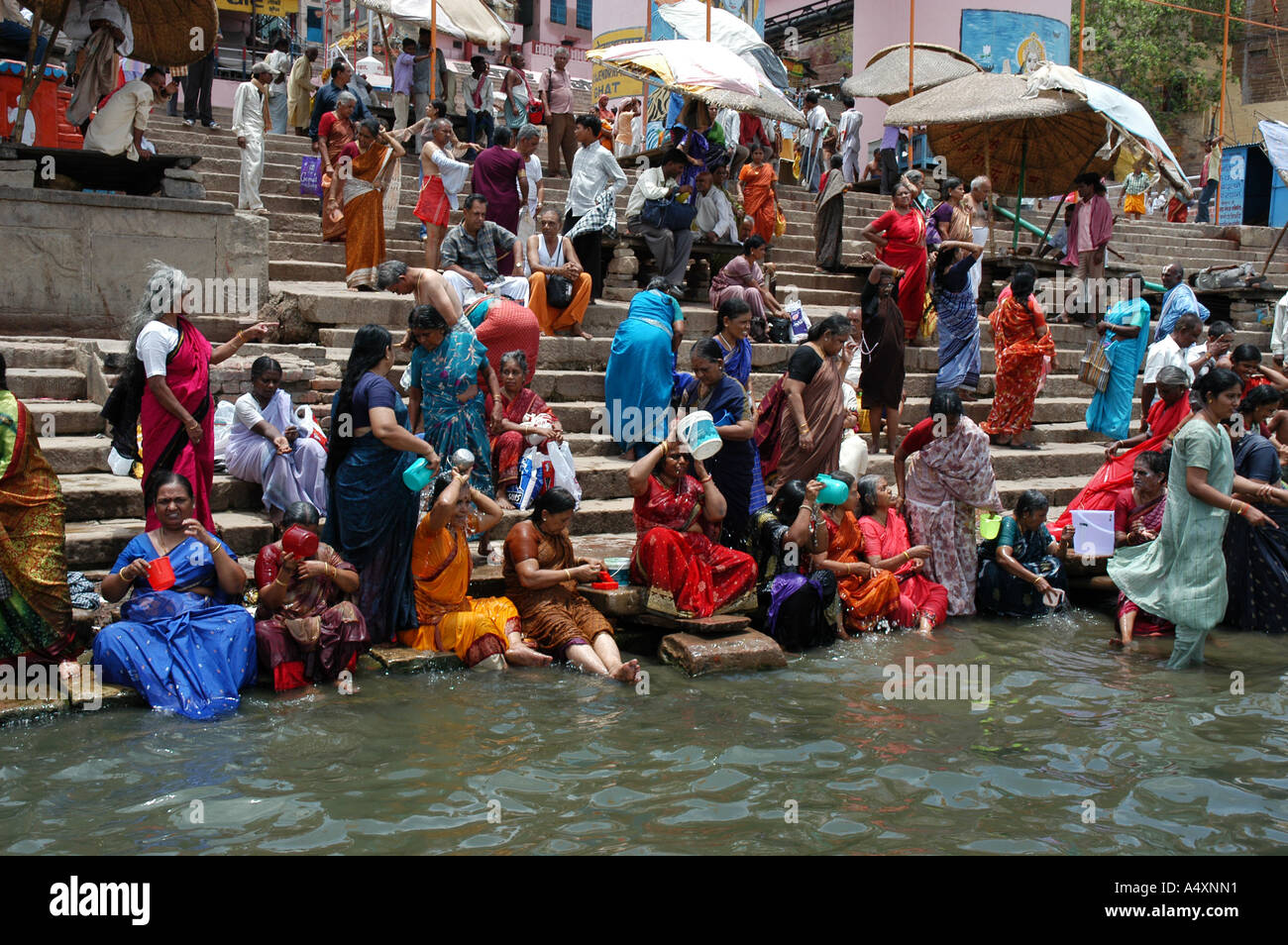Indian woman washing on bathing step in Varanasi Stock Photo - Alamy