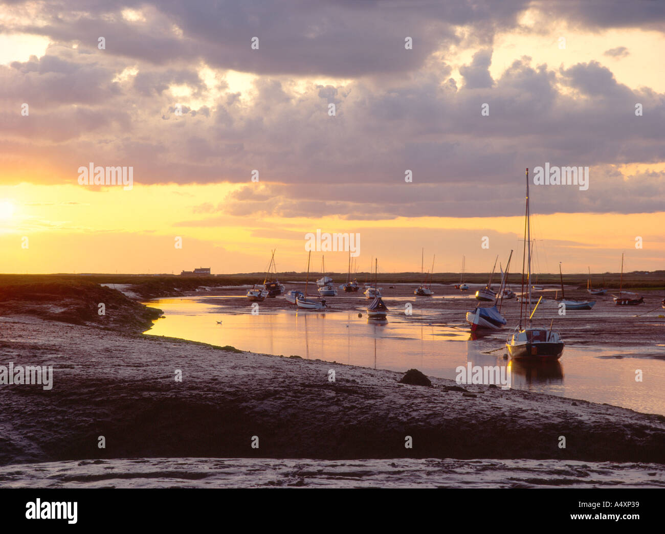 Sunset over salt marshes at Brancaster Staithe Norfolk England UK Stock ...