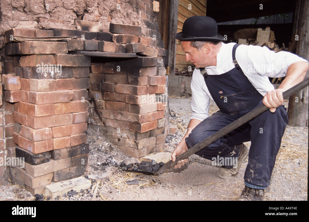 Colin Richards making bricks by hand setting the fie in the kiln Stock ...