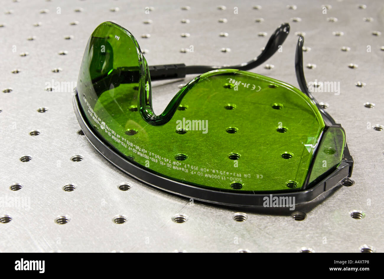 Laser safety goggles on an optical table, shallow depth of focus Stock ...