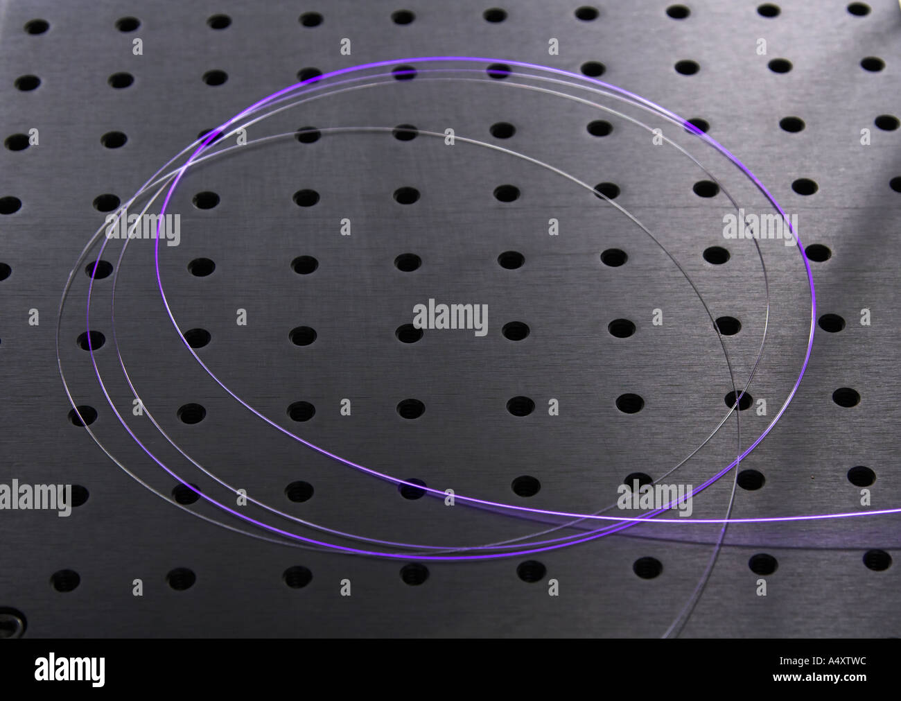 A cladding-pumped doped optical fiber is used in the lab for light ...