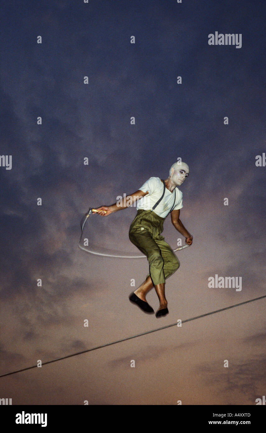 Rope dancer. Skipping. Man jumping with a rope on a rope Stock Photo ...