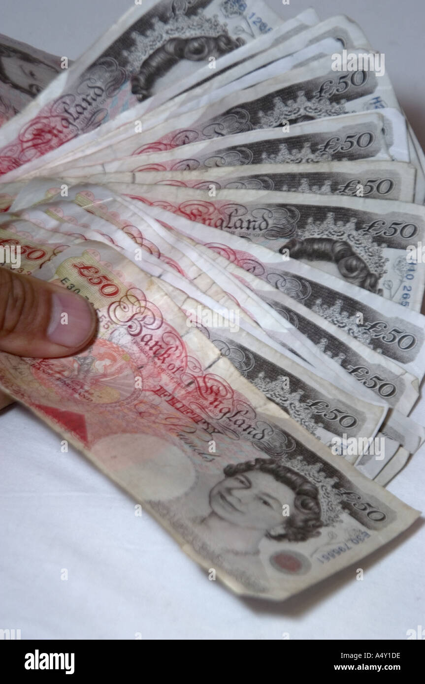Hand with fan cash uk hi-res stock photography and images - Alamy