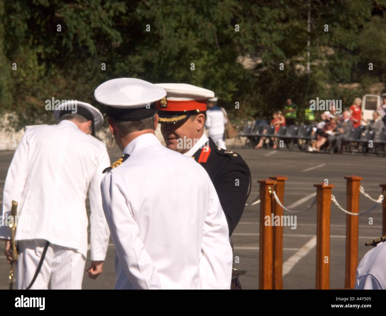 A Naval Commander talking with an Army Colonel during the Honorary ...