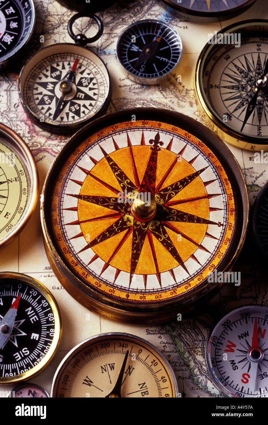 Map maps compass compasses still life hi-res stock photography and ...