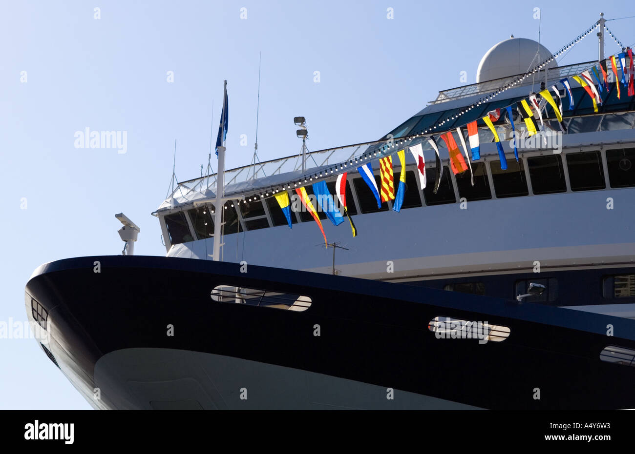 Flags of many nations fly over cruise ship Celebrity Mercury docked in ...