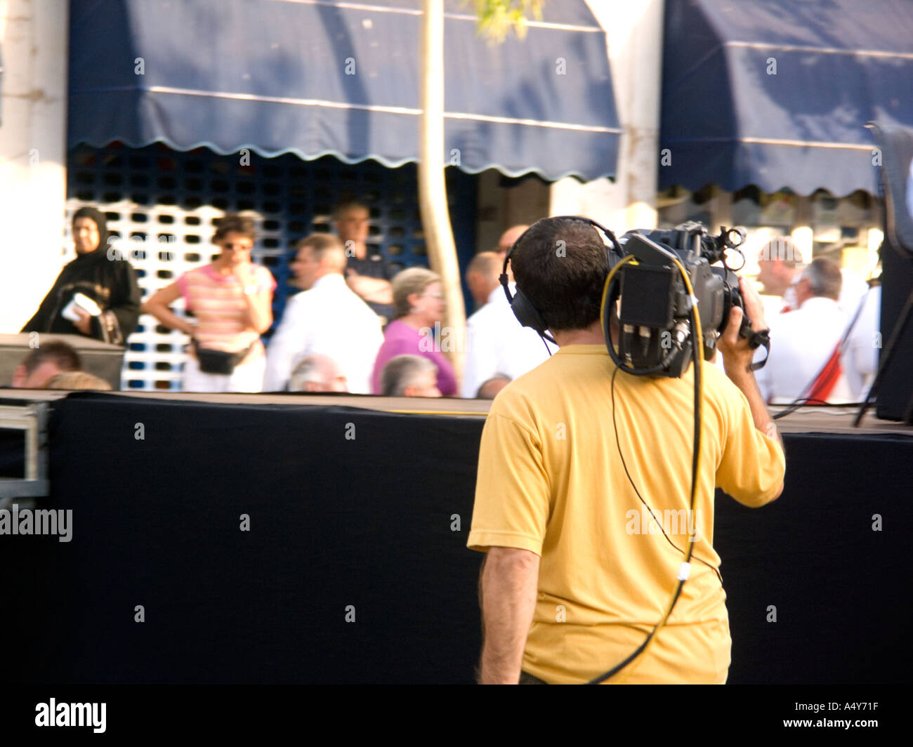 TV Cameraman at work filming outdoors, Gibraltar, Europe Stock Photo ...