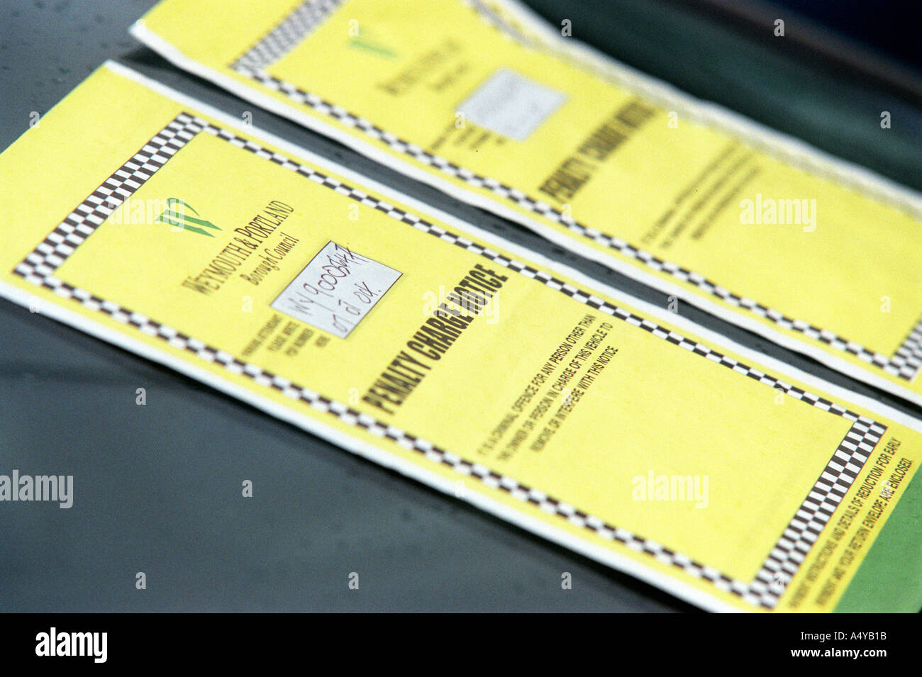 Two parking tickets on a car windscreen in Britain UK Stock Photo - Alamy