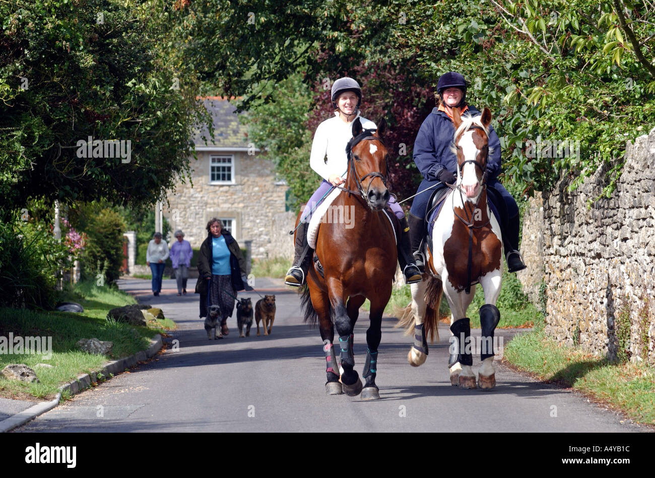Horseriders in a countryside village in Britain UK Stock Photo - Alamy