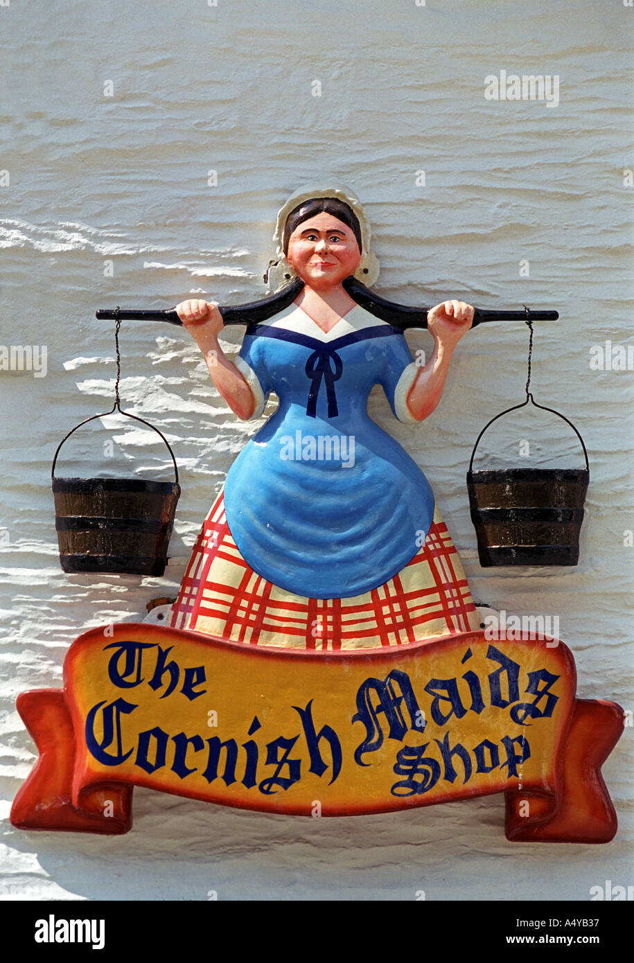 A Cornish Maid sign on a shop wall in Polperro Cornwall Britain uk ...