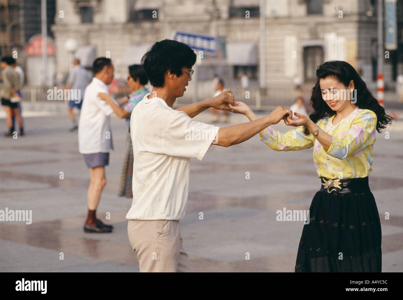 Women perform morning Thai chi exercises and ballroom style dance in ...
