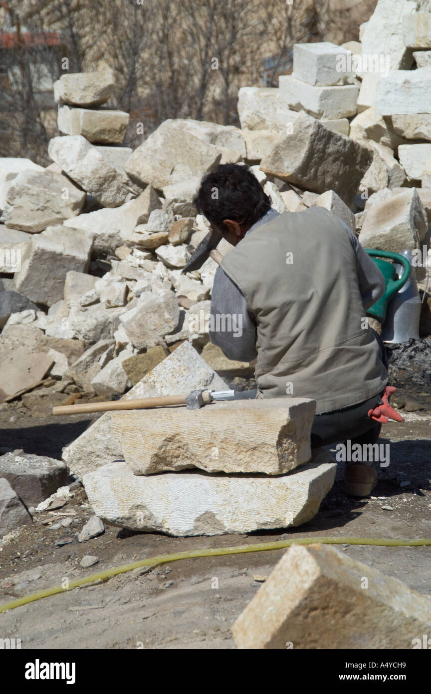Stone masons at work building structure in Cappadocia Turkey Stock ...