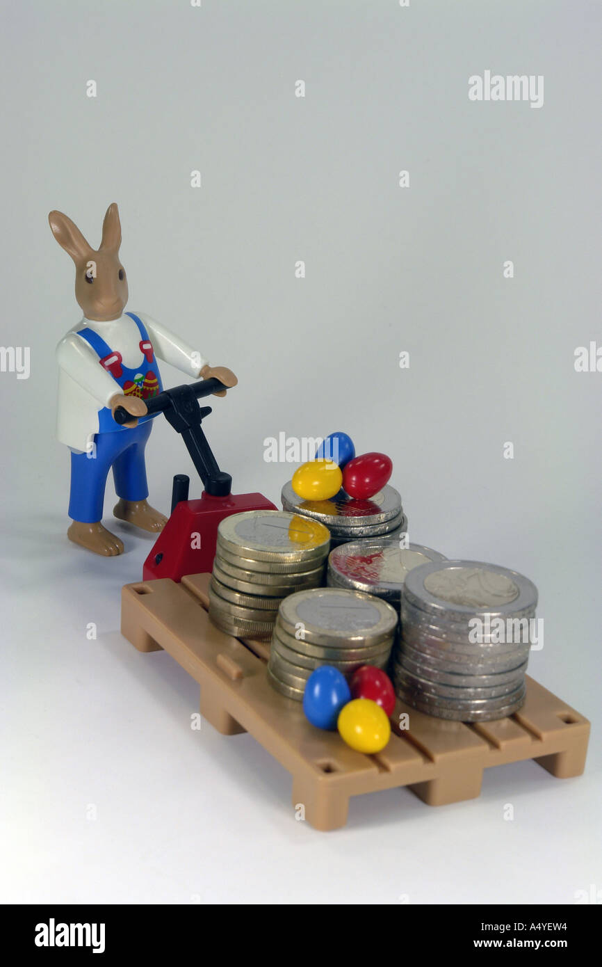 Easter bunny with euro coins as symbole for expensive easter shopping ...